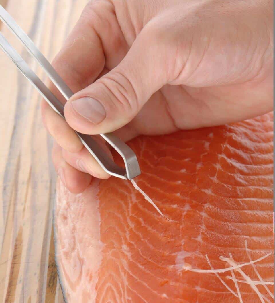 How do you find and remove pin bones from fish?