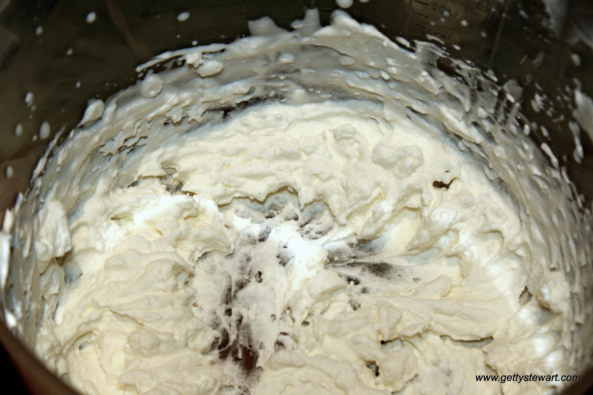 How do you fix over whipped frosting?