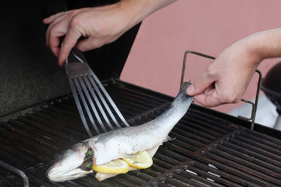 How do you flip fish in cooking?
