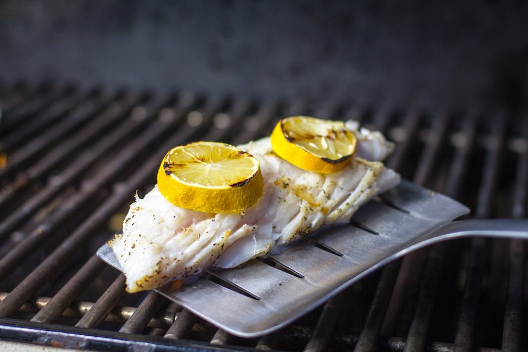 How do you flip fish on a Weber grill?