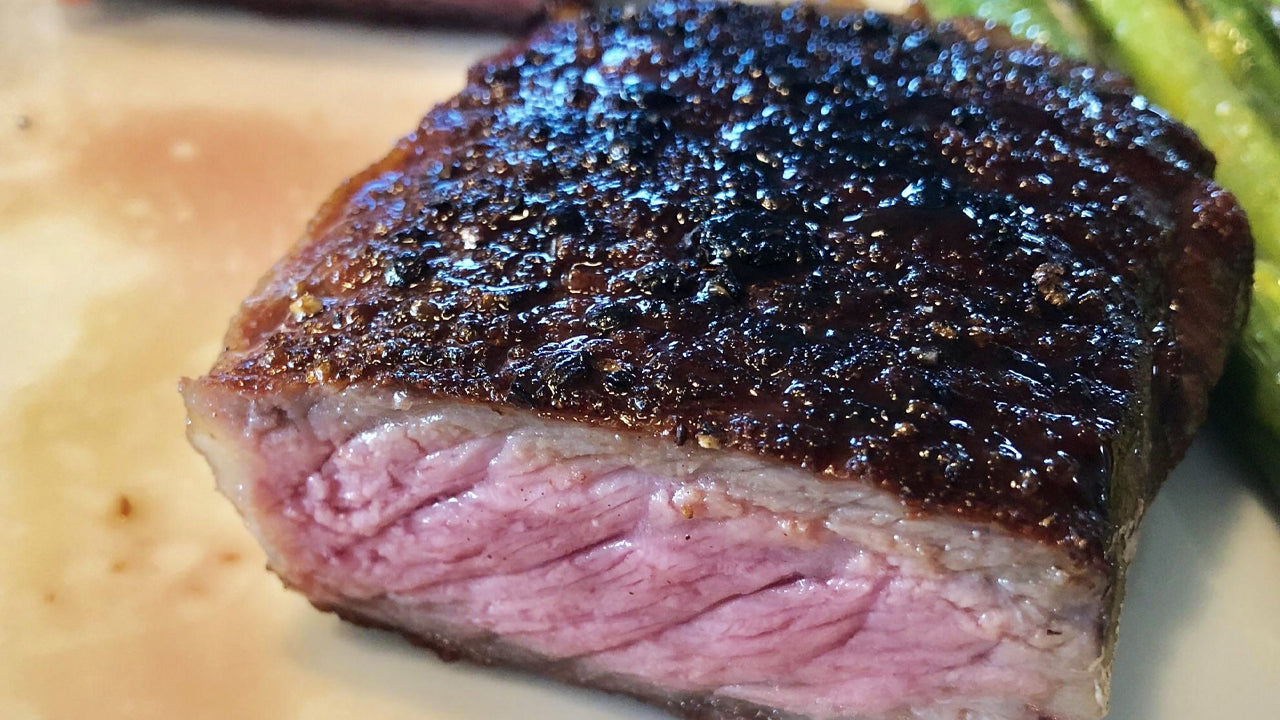 How do you get an even crust on a steak?