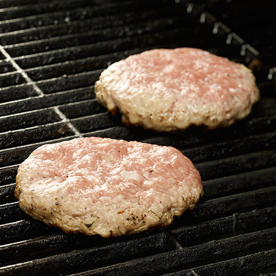 How do you grill burgers without sticking them?