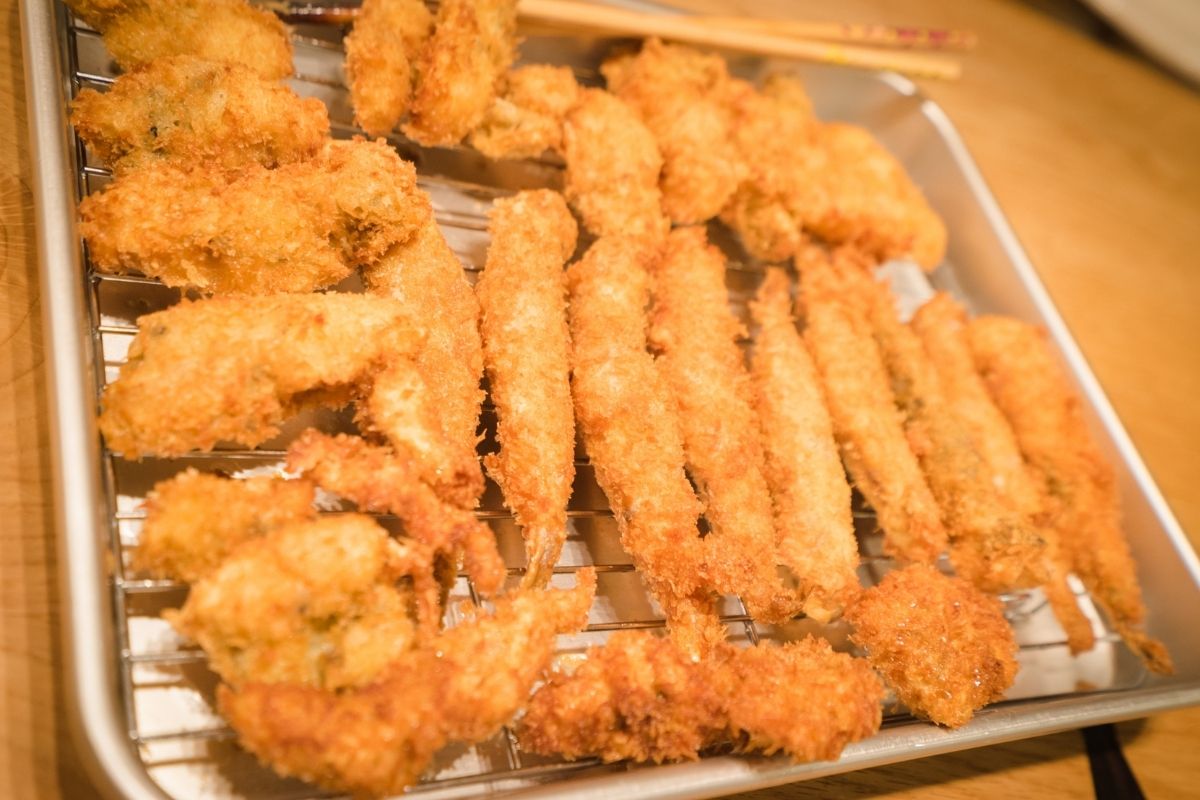 How do you heat up leftover fried shrimp?