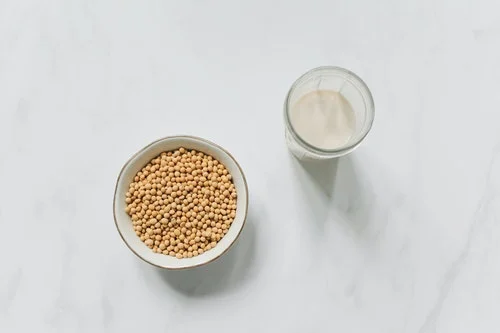 How do you heat up soy milk without curdling?