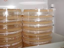 How do you incubate bacterial plates?