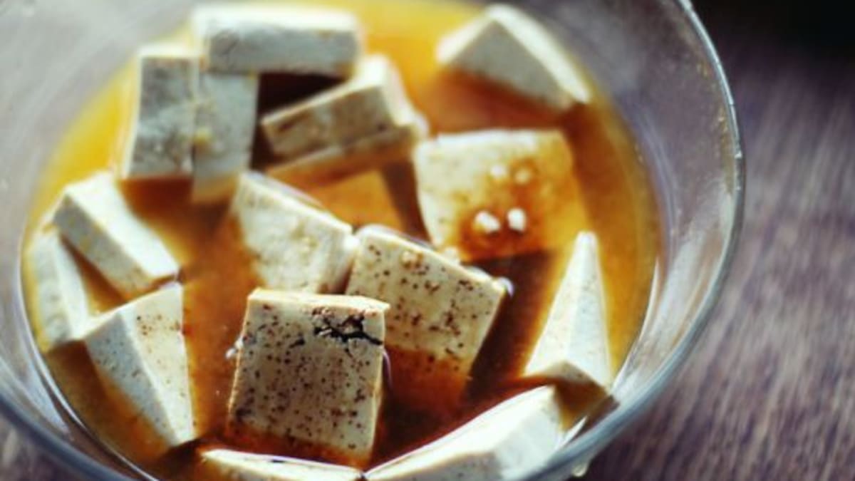 How do you inject flavor into tofu?