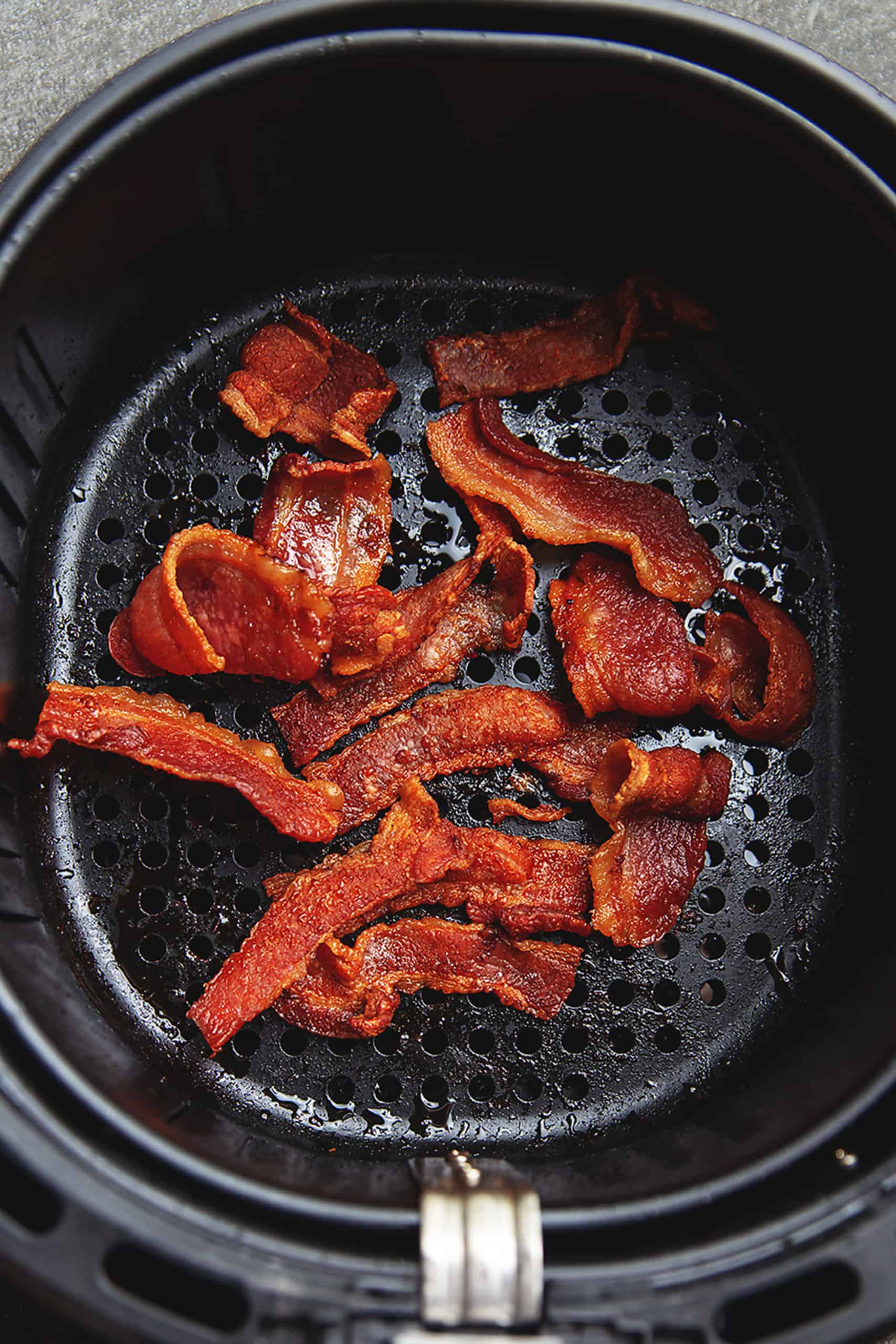 How do you keep bacon from curling in air fryer?