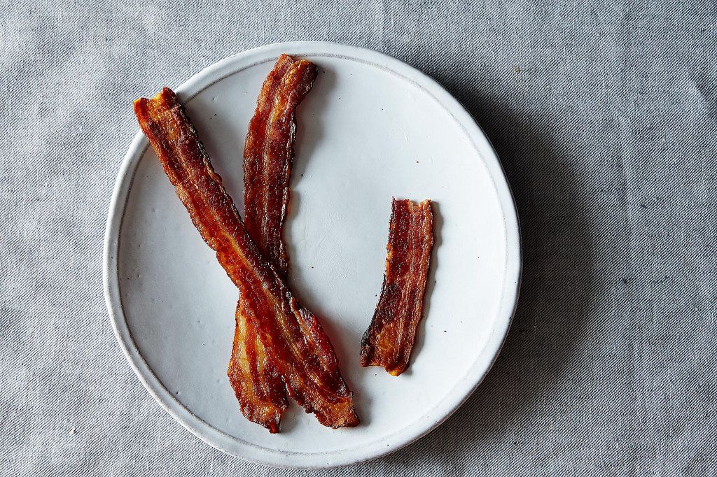 How do you keep bacon from wrinkling?