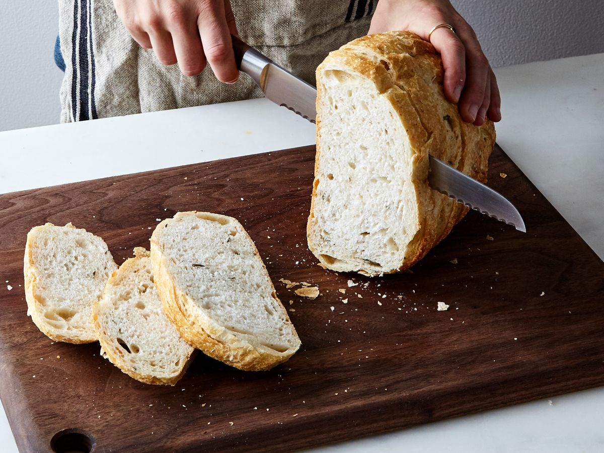 How do you keep bread from crumbling when cutting?