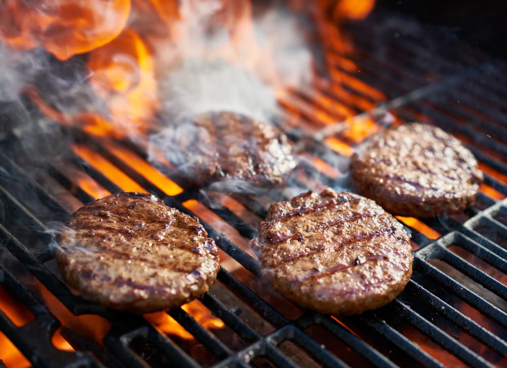 How do you keep burgers from sticking to the grill?