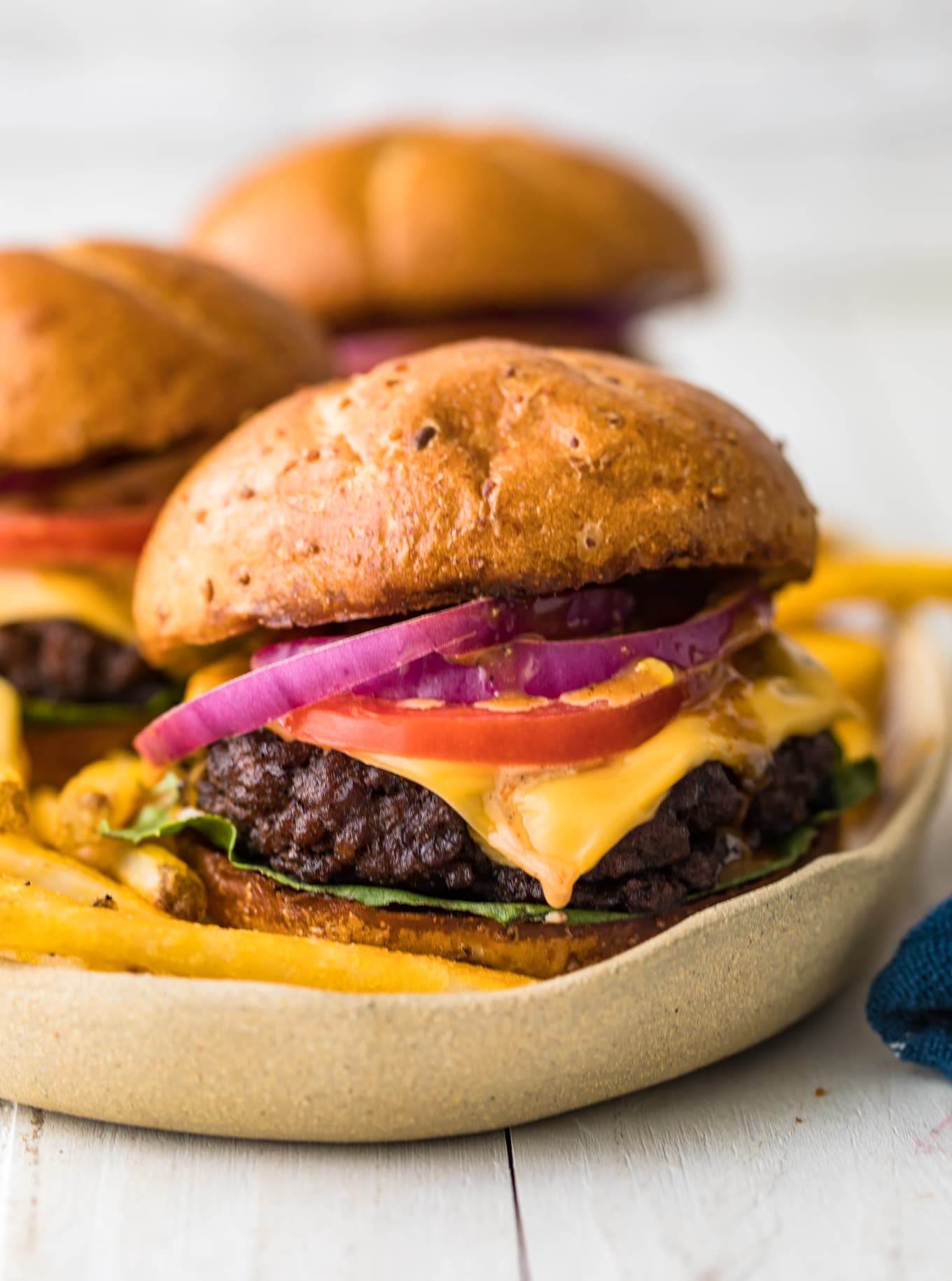 How do you keep burgers juicy on the grill?