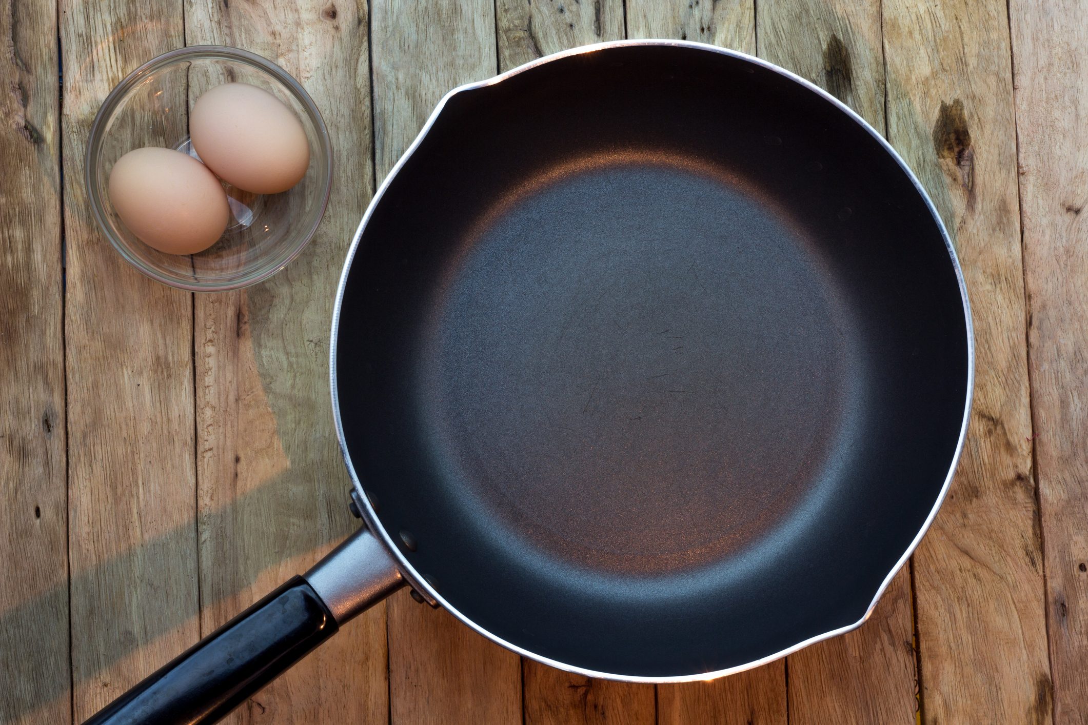 How do you keep food from sticking to a frying pan?