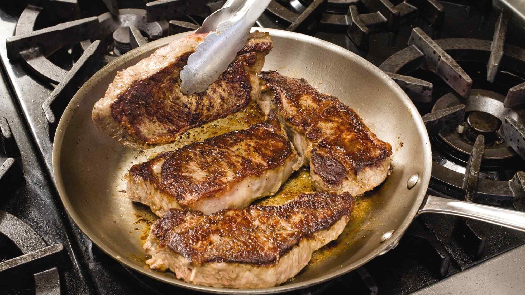 How do you keep meat from sticking to stainless steel?