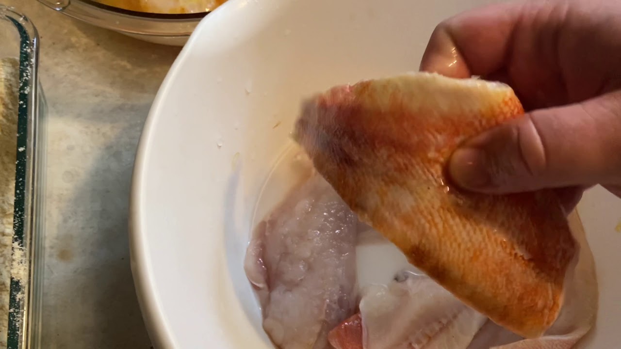 How do you keep ocean perch from curling when cooking?