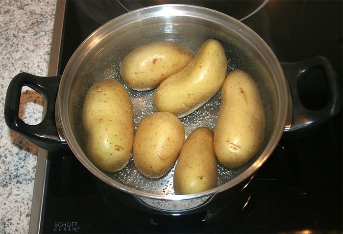 How do you keep potatoes from falling apart when boiling them?