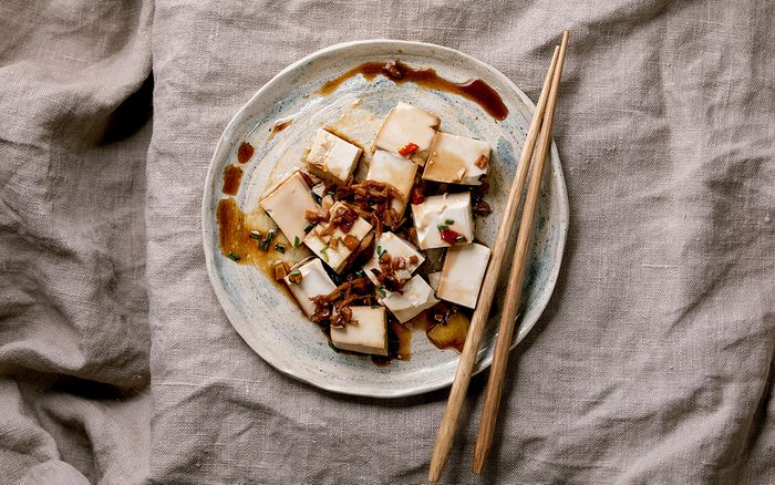 How do you keep tofu from falling apart when cooking?