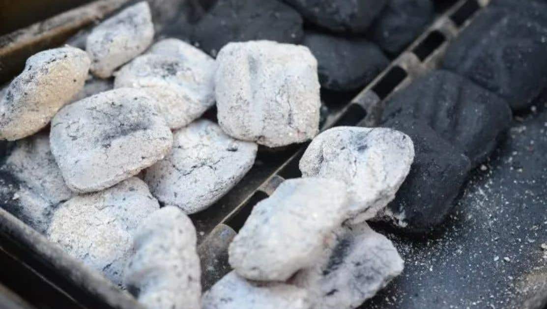 How do you know when charcoal is ready to grill on?