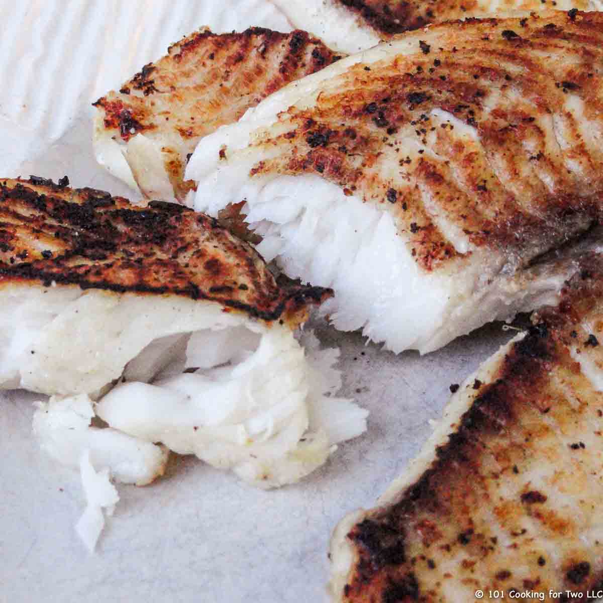 How do you know when tilapia is done on the grill?