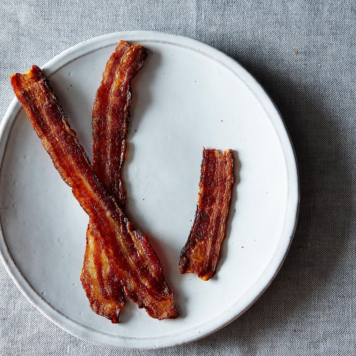 How do you make bacon lay flat?