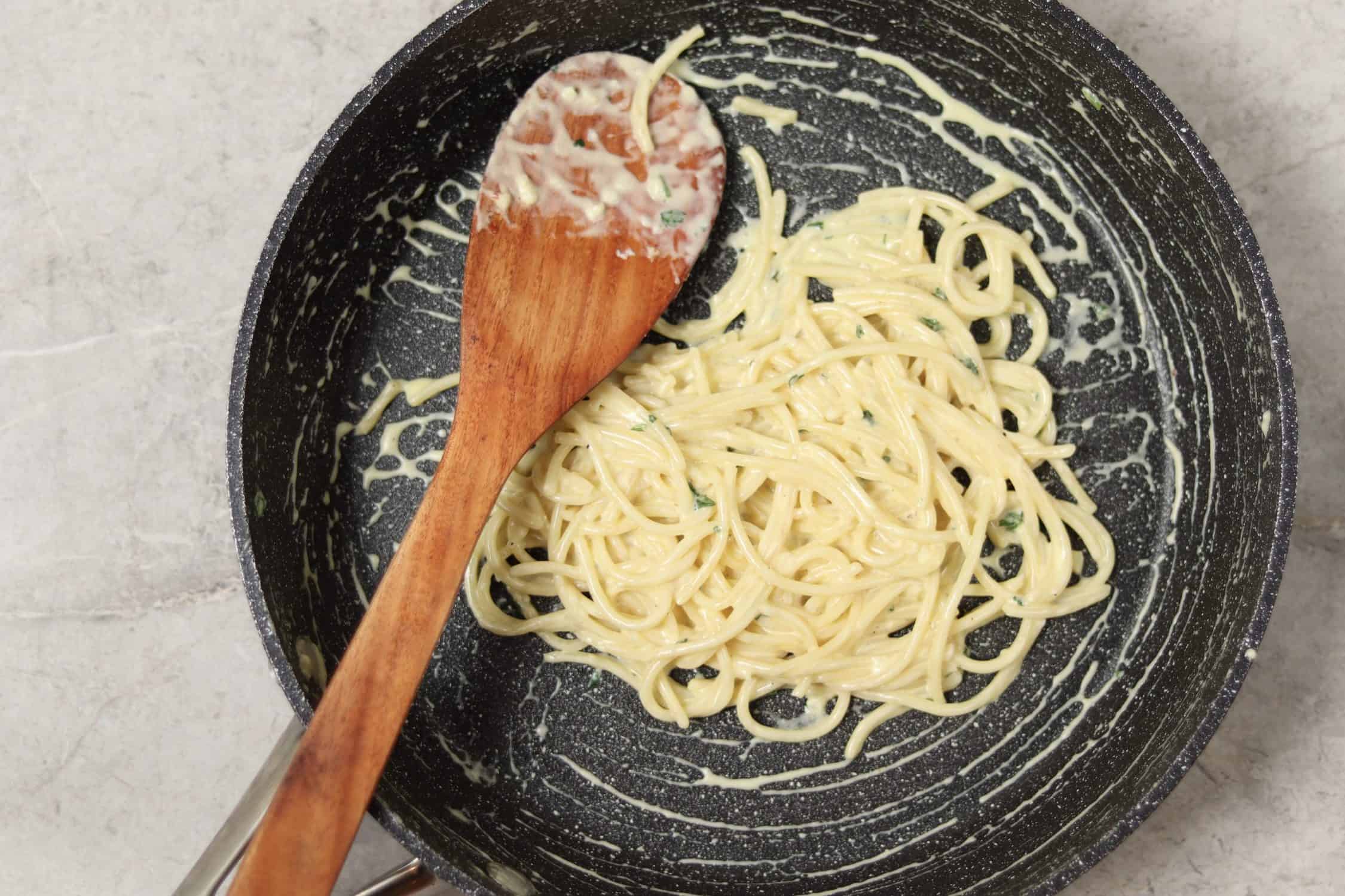 How do you make pasta creamy again?