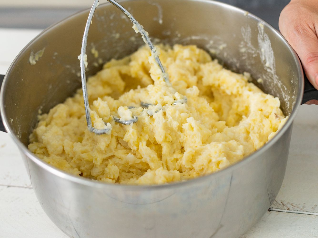 How do you make potato mash gluey?