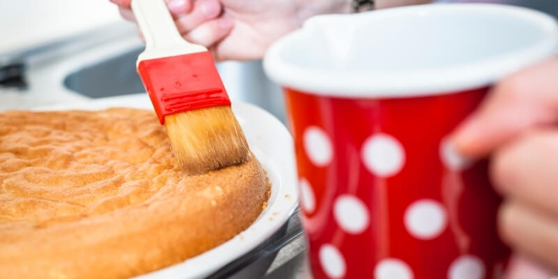 How do you moisten dry cake after baking?