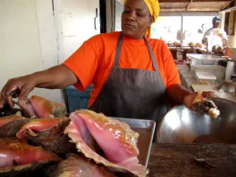 How do you prep conch for cooking?