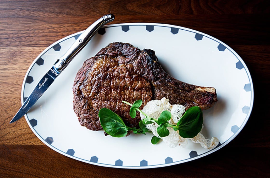 How do you prepare a steak for a crowd?