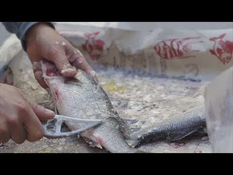 How do you properly clean fish before cooking?