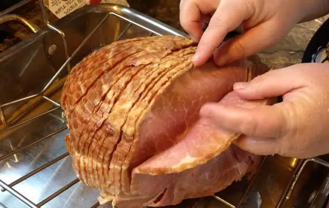 How do you reheat a cooked ham without drying it out?