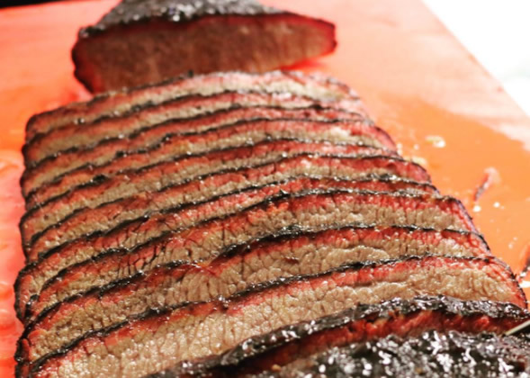 How do you reheat a whole smoked brisket?
