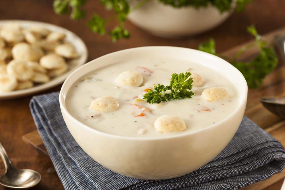 How do you reheat clam chowder on the stove?