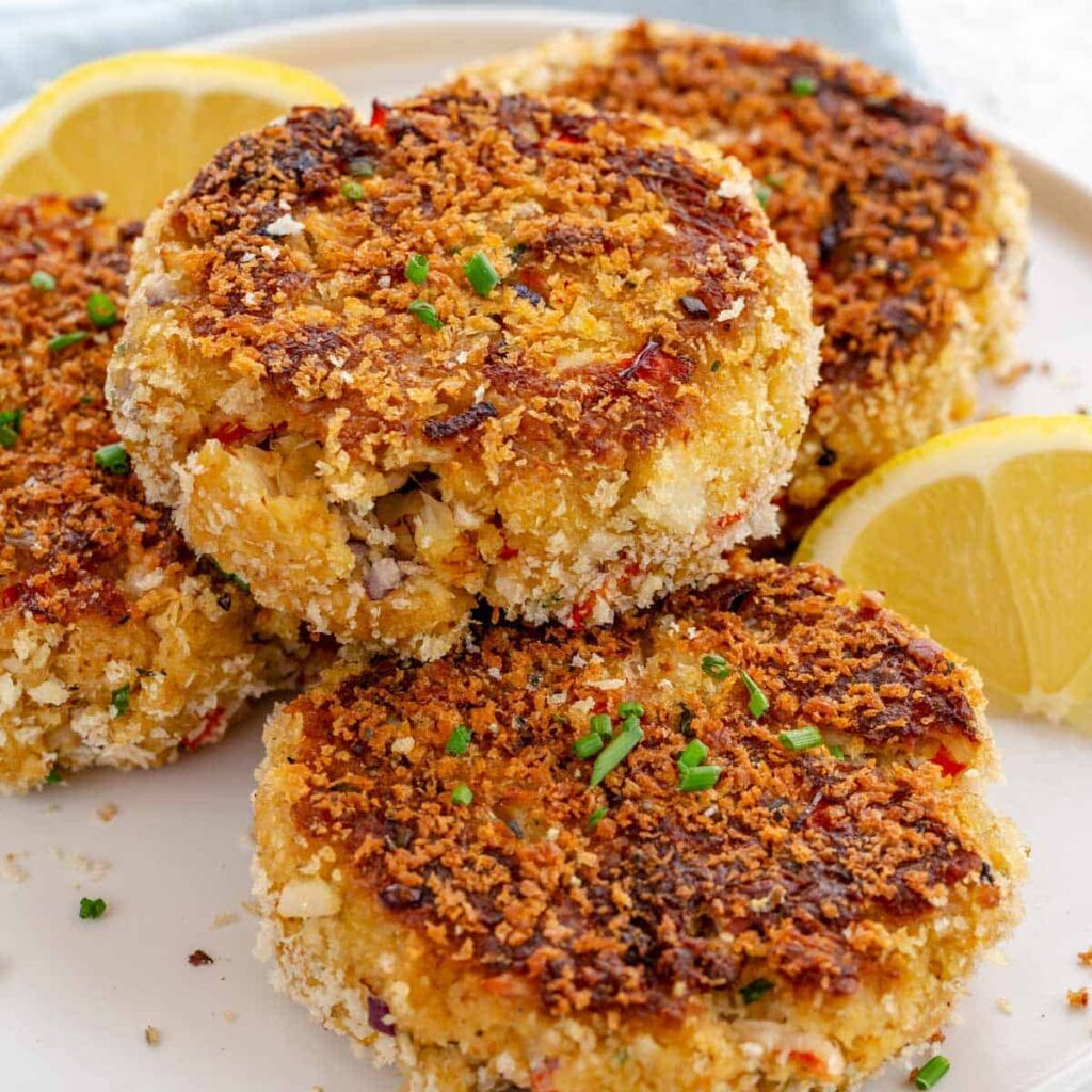 How do you reheat cooked crab cakes in the oven?