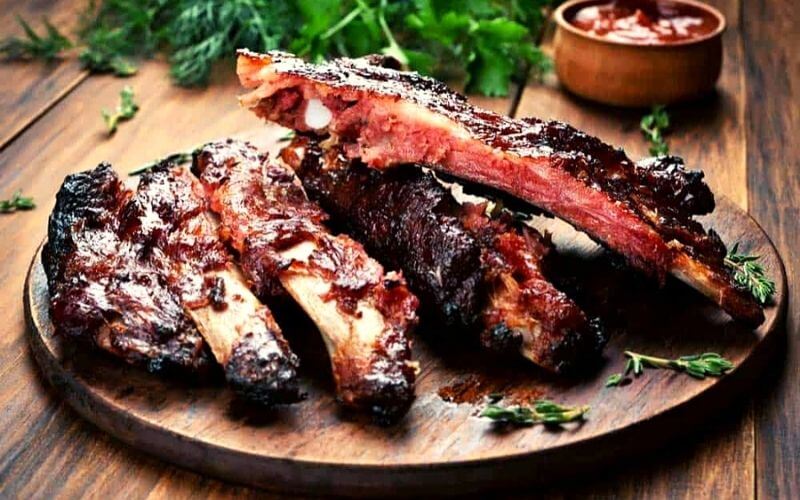 How do you reheat ribs and make them tender?