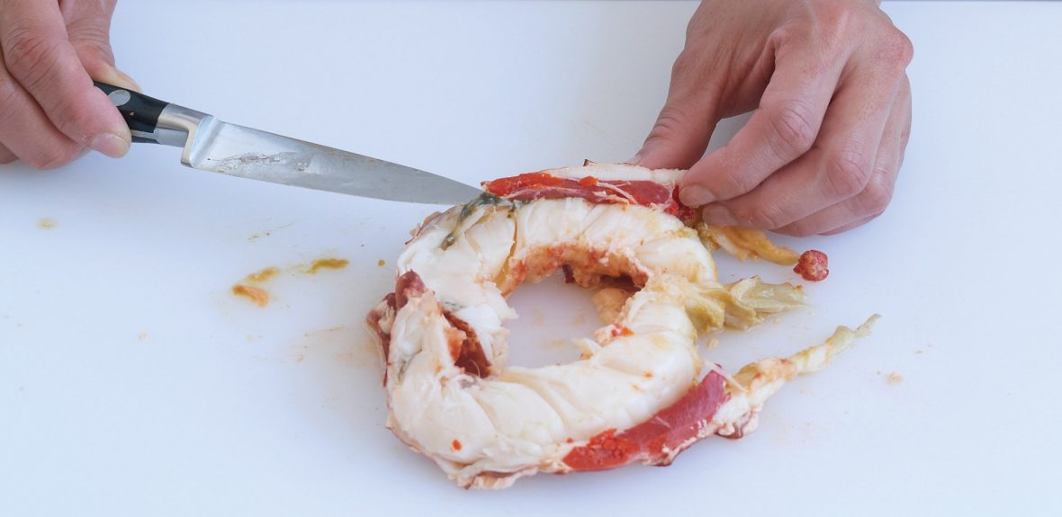 How do you remove the meat from a cooked lobster?