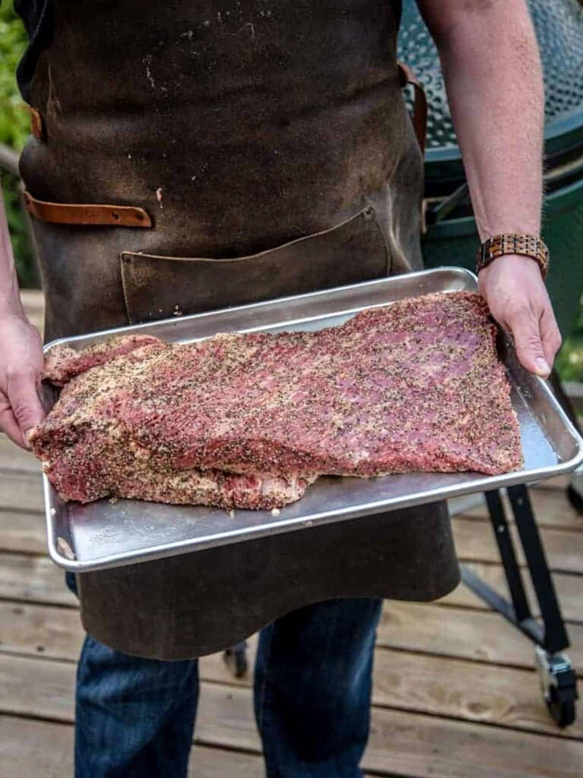 How do you season a brisket before cooking?