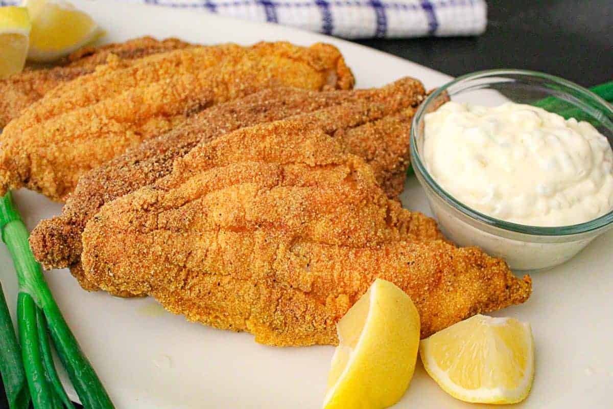 How do you season catfish before frying?
