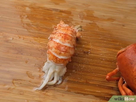 How do you separate a lobster tail from its body?