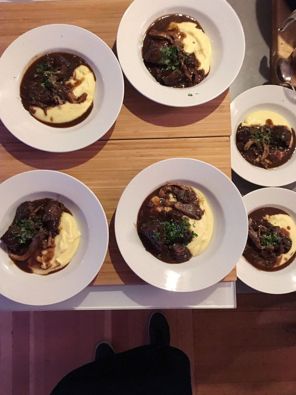 How do you serve Beef Bourguignon at a dinner party?