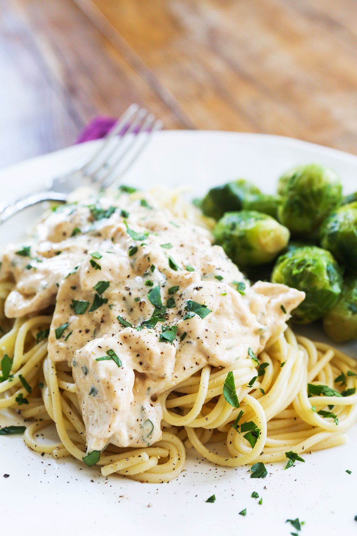 How do you spice up a bland Alfredo sauce?