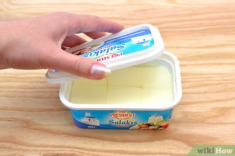 How do you store feta cheese in the fridge?