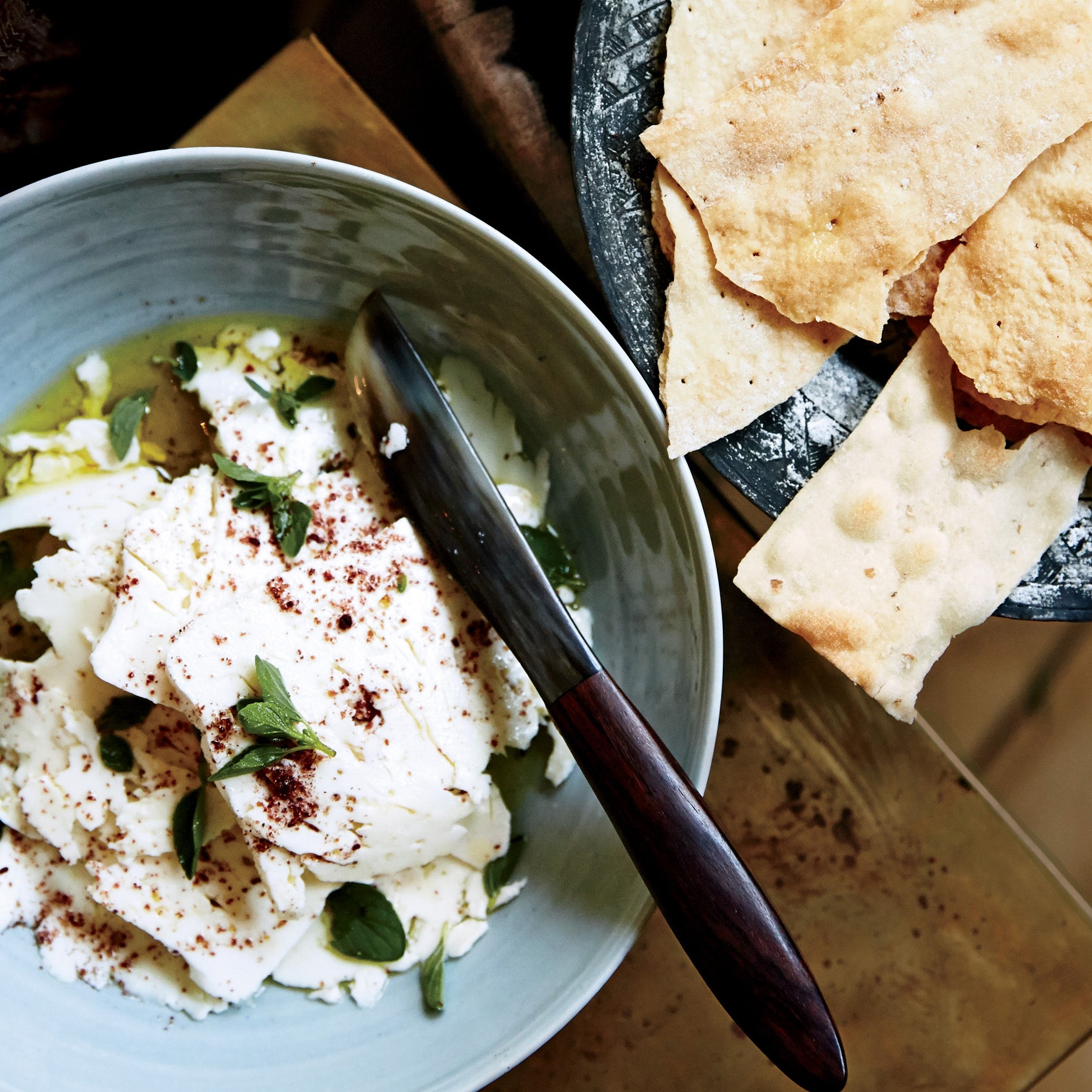 How do you store leftover feta cheese?