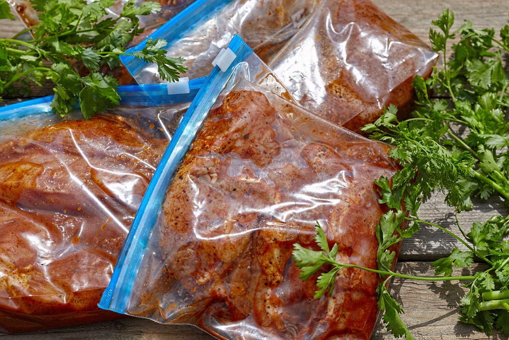 How do you store marinated meat in the fridge?