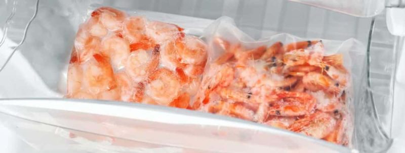 How do you store raw shrimp in the fridge?