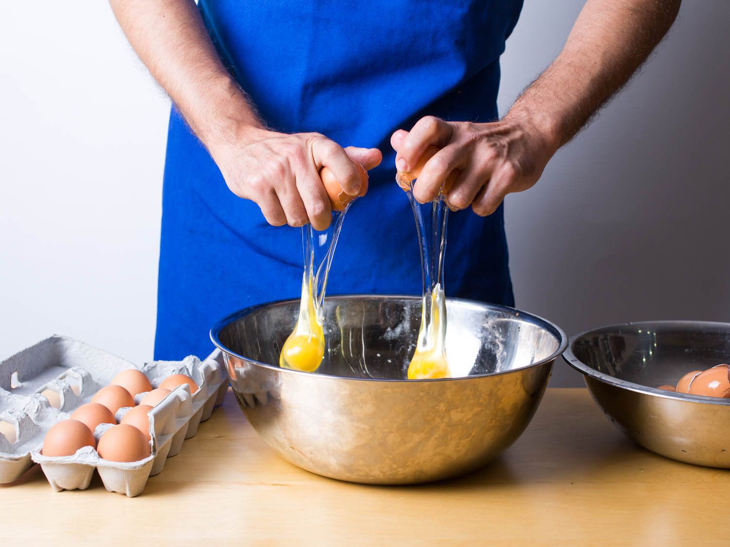 How do you temper an egg into hot liquid?