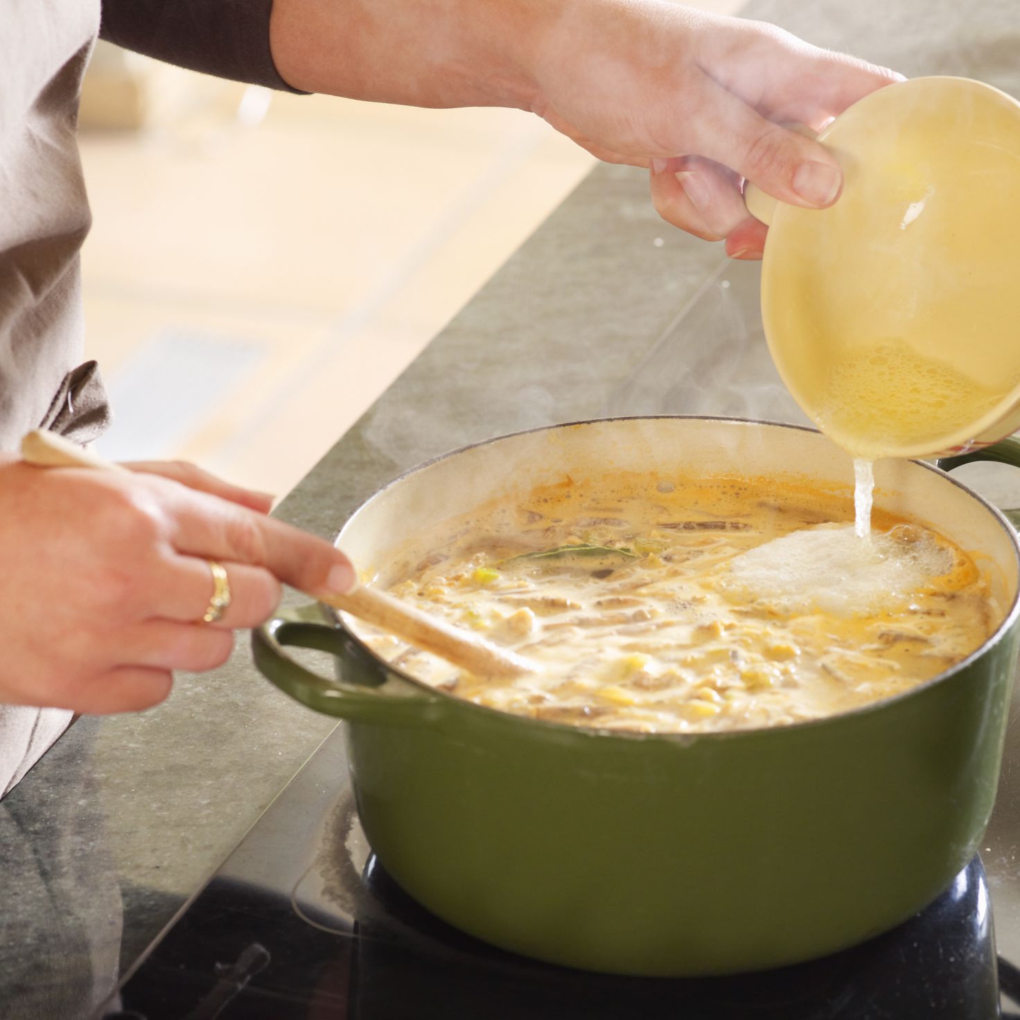 How do you temper milk when making soup?