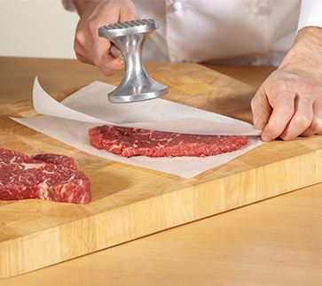 How do you tenderize meat with wax paper?
