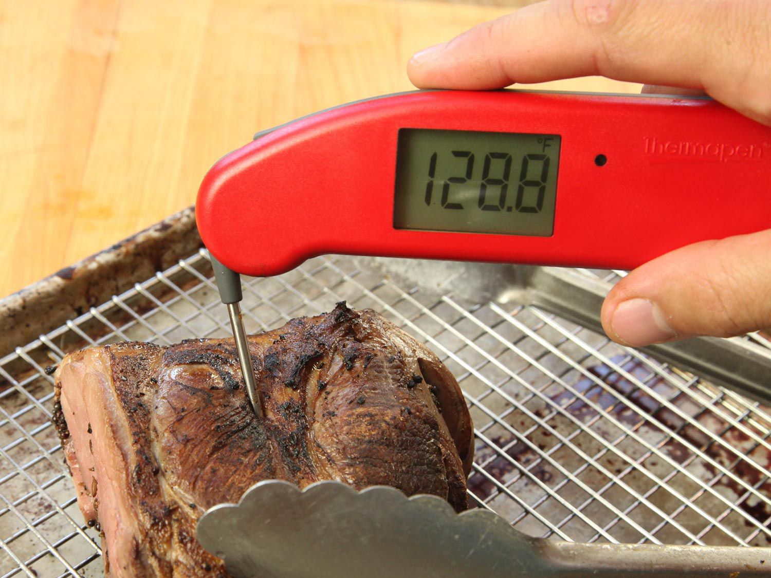 How do you test meat with a thermometer?