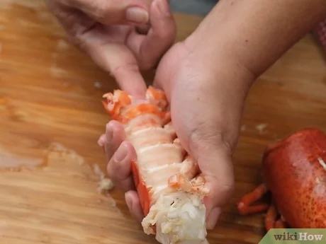 How do you uncurl a lobster tail?