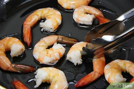 How do you warm up already cooked shrimp?